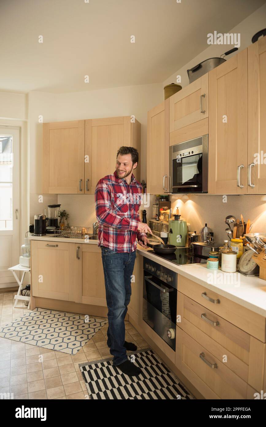 Kitchen back man standing hi-res stock photography and images - Alamy