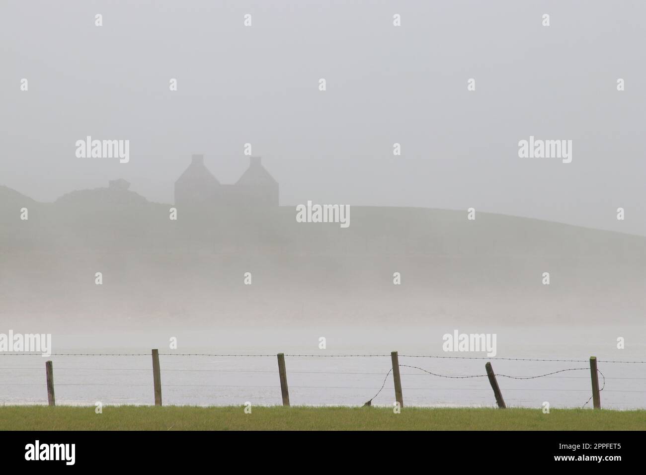 Ruins of cottage and fence in mist Stock Photo - Alamy