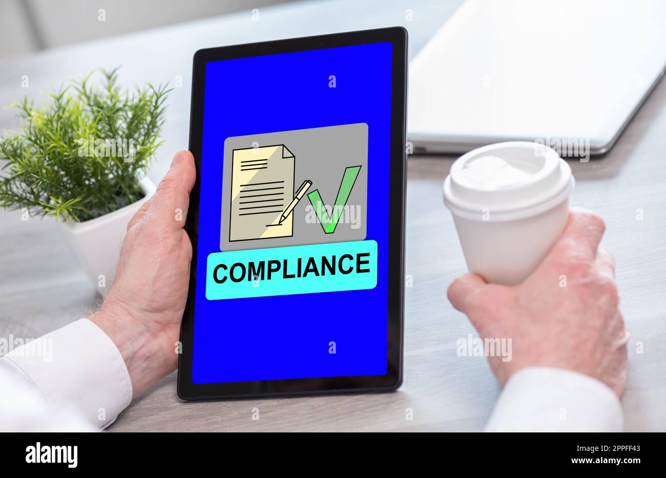 Tablet screen displaying a compliance concept Stock Photo - Alamy