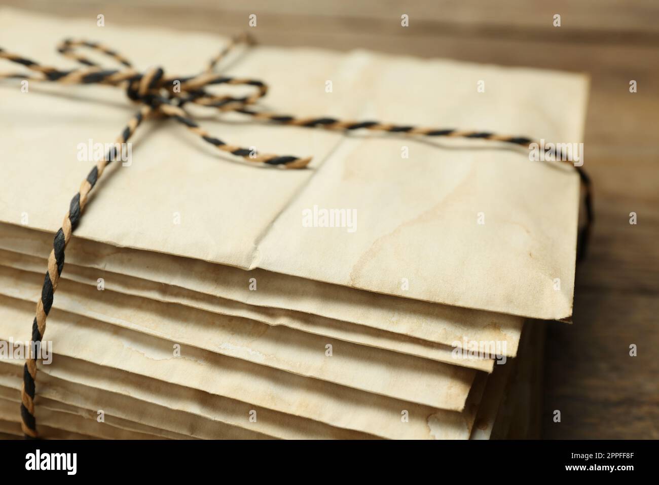 Stack of old letters tied with string on wooden table, closeup Stock ...