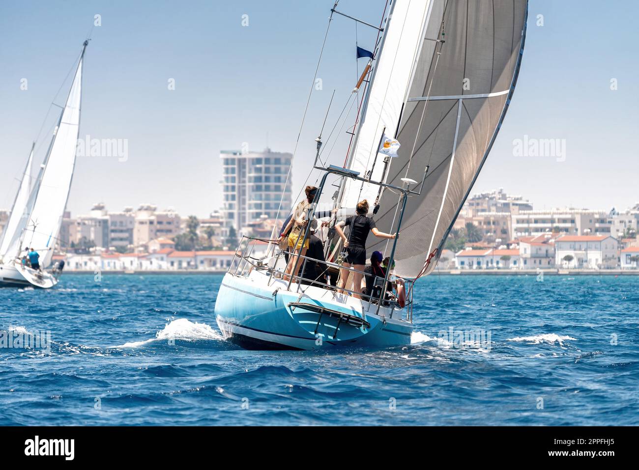 Sailing crew on sailboat during regatta at Larnaca bay Stock Photo - Alamy