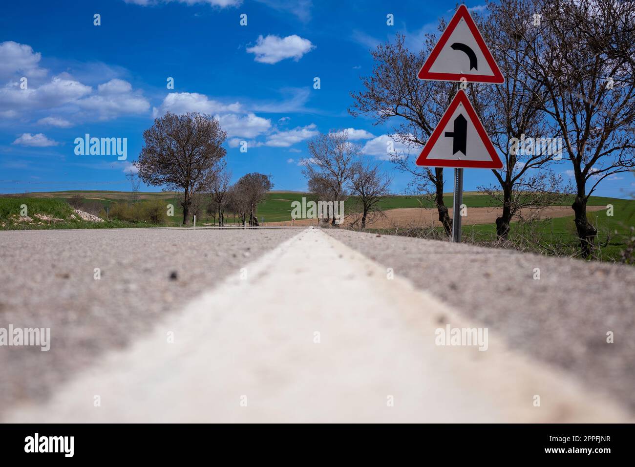 Roadside Signs Against a Backdrop of Lush Green Mountains Stock Photo ...