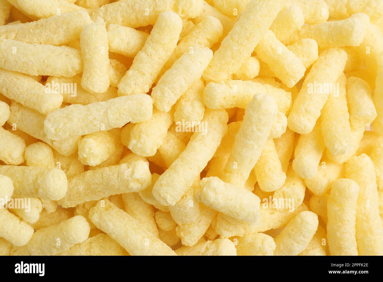 Tasty sweet corn sticks as background, top view Stock Photo - Alamy