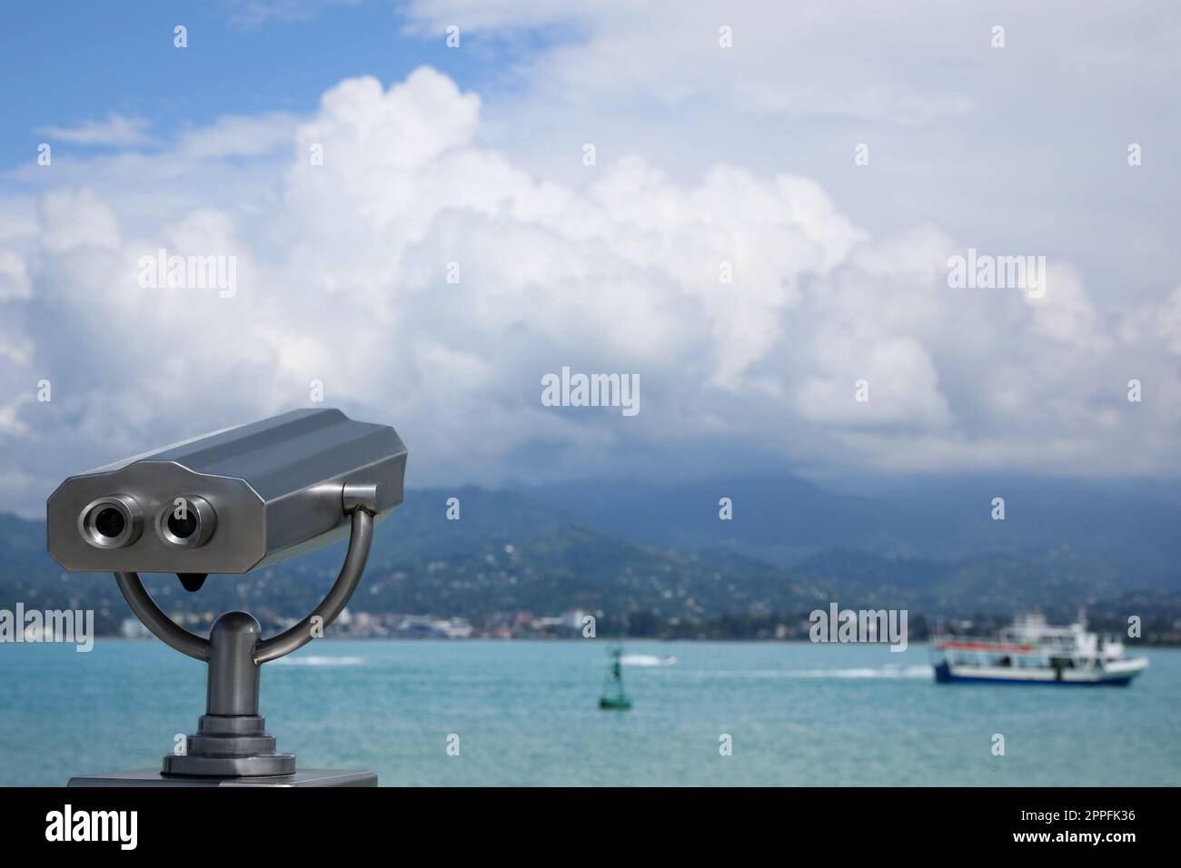 Metal tower viewer installed near sea, space for text. Mounted ...