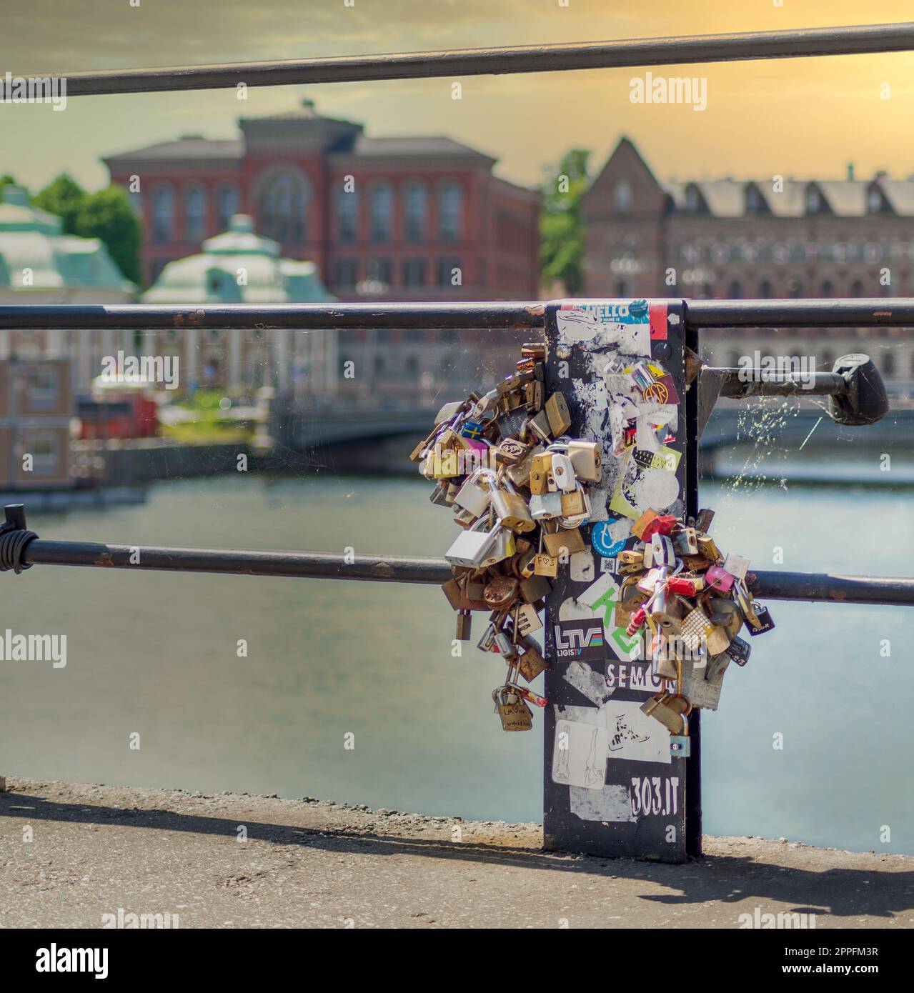 Love locks attached by lovers to the railing of Riksbron Bridge, or The ...