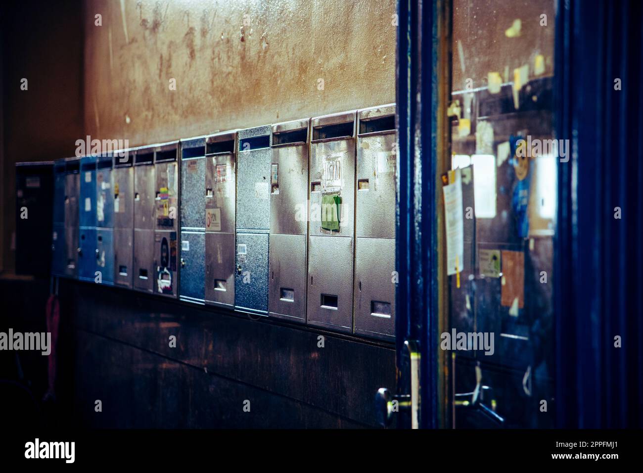 Metal mailboxes in the entrance hallway of an old apartment building ...
