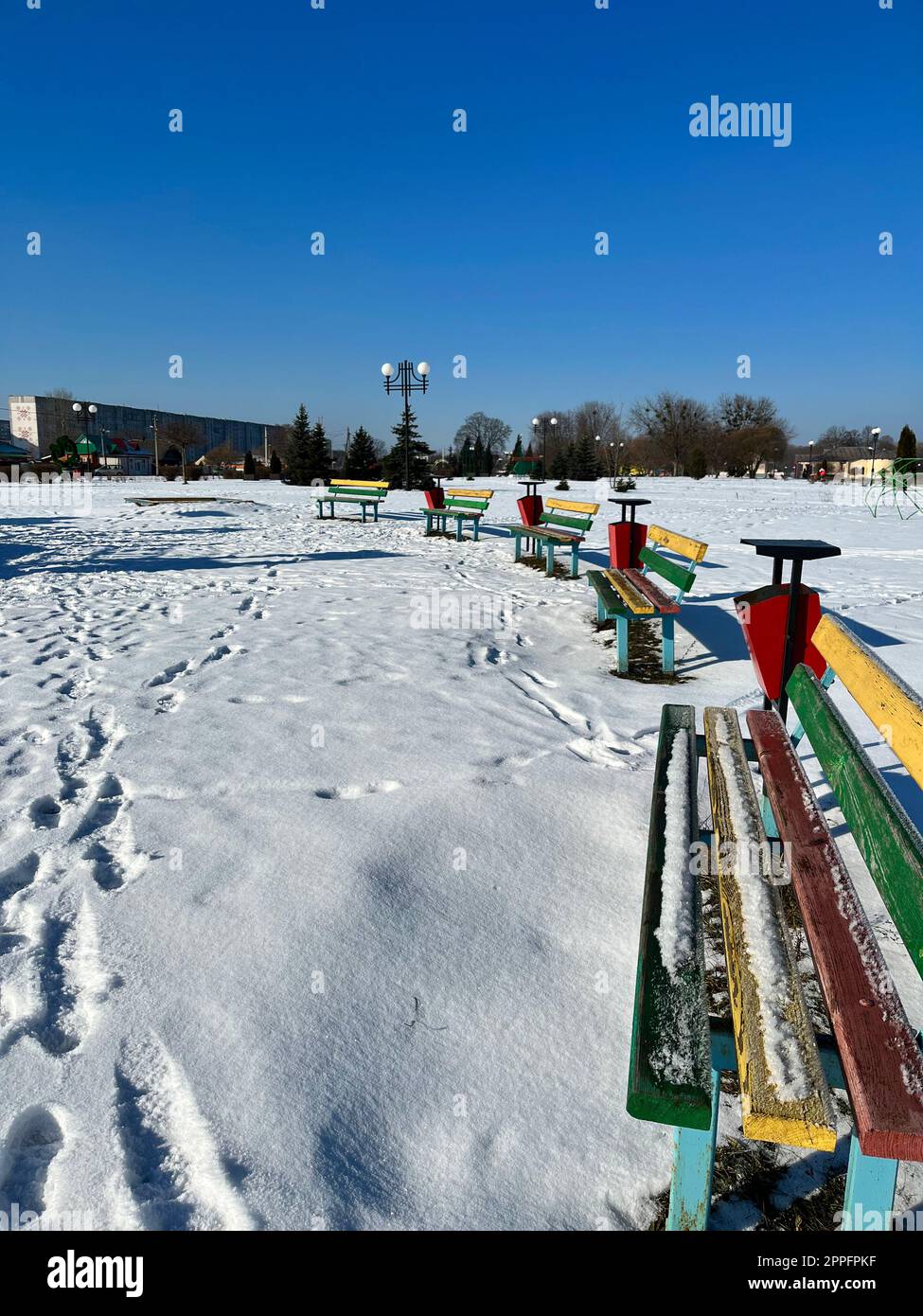 the embankment in winter and colorful benches Stock Photo - Alamy