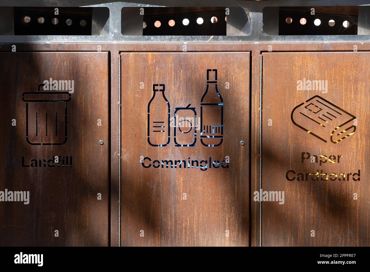 Garbage cans made of rusted Corten steel with separate bins for paper ...