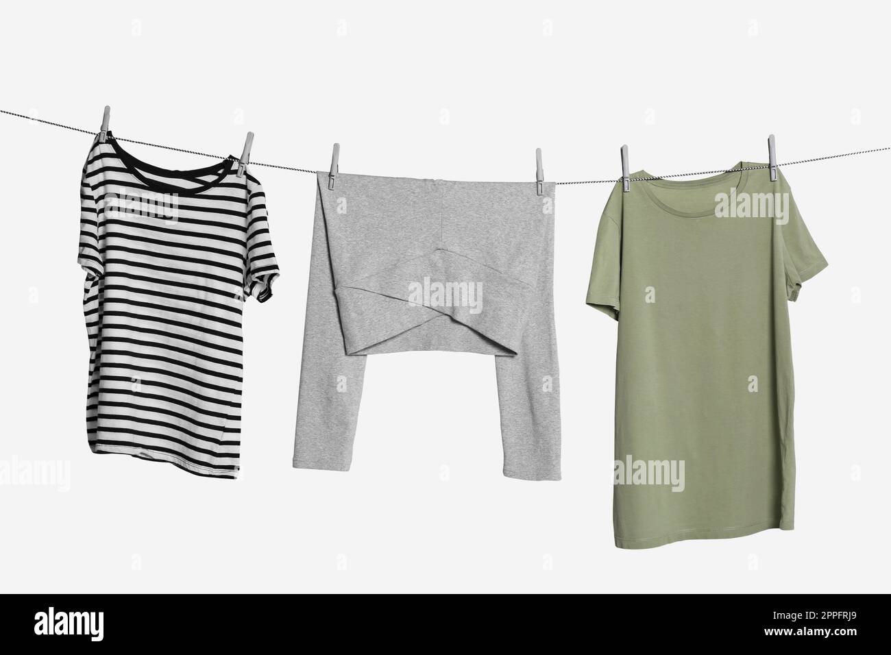 Different clothes drying on laundry line against white background Stock ...