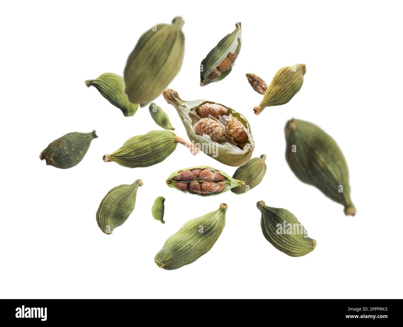 Dry green cardamom pods with seeds falling on white background Stock ...
