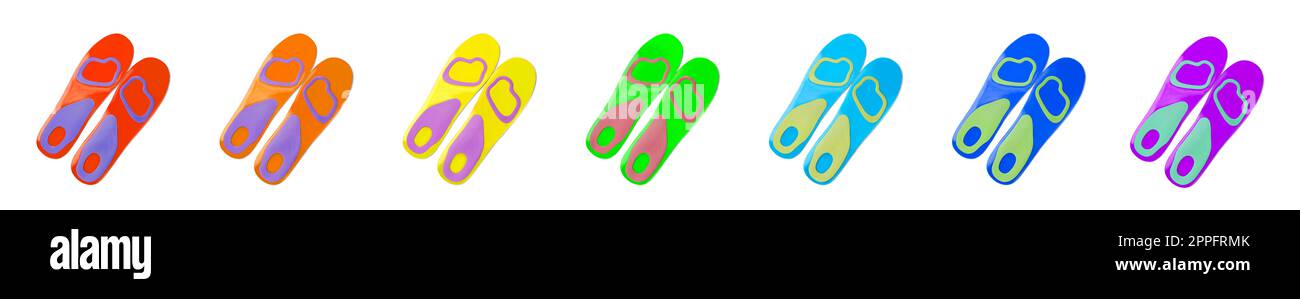 Set with colorful orthopedic insoles on white background, top view ...