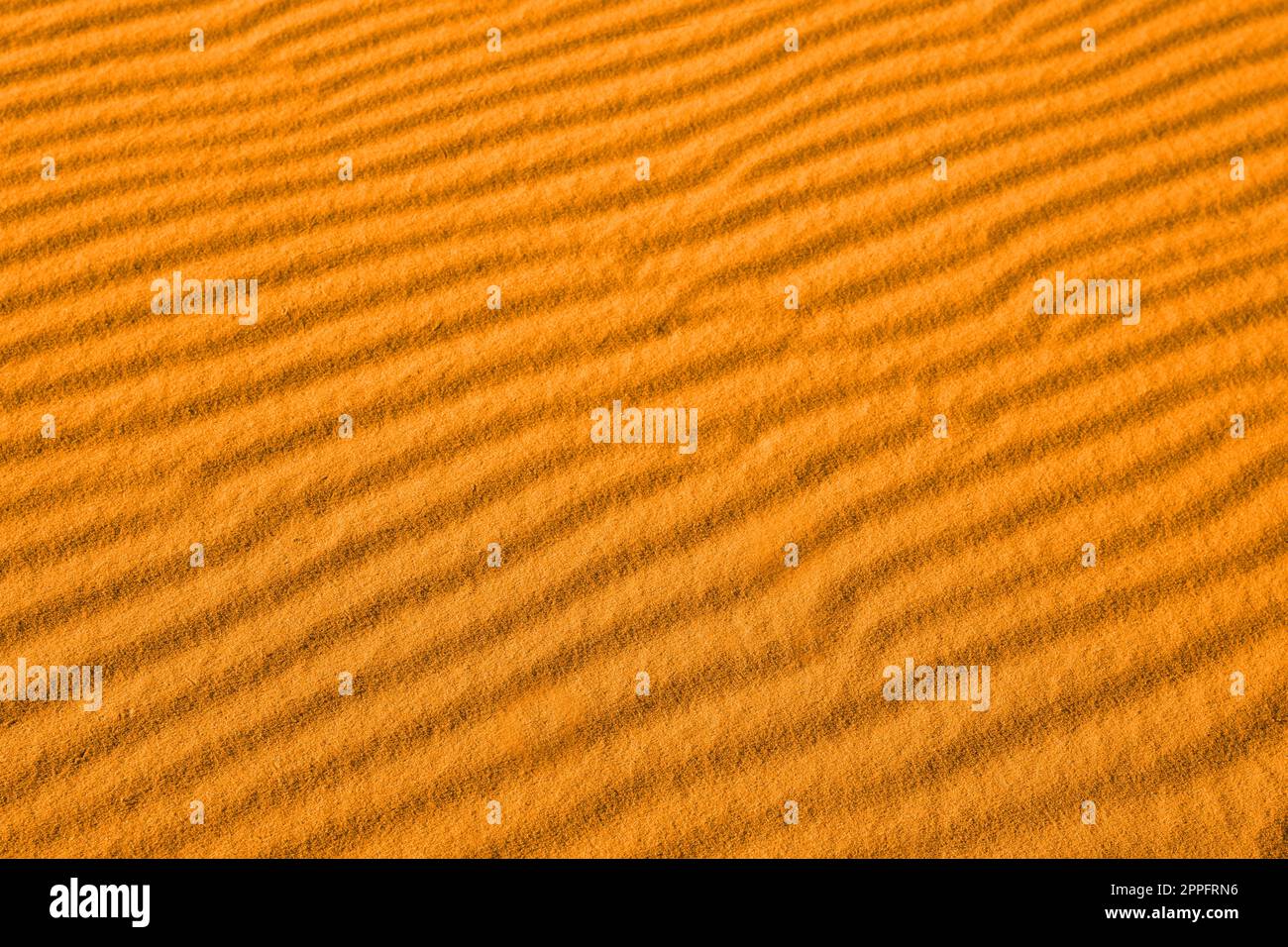 Closeup view of orange sand dune in desert as background Stock Photo ...
