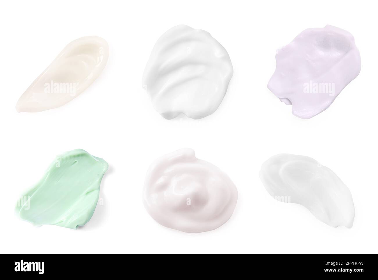 Set of different hand creams samples on white background, top view ...