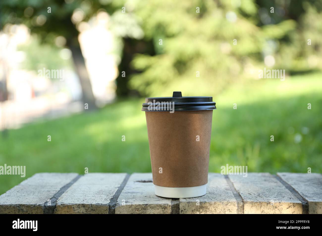Paper cup on street outdoors. Takeaway drink Stock Photo - Alamy