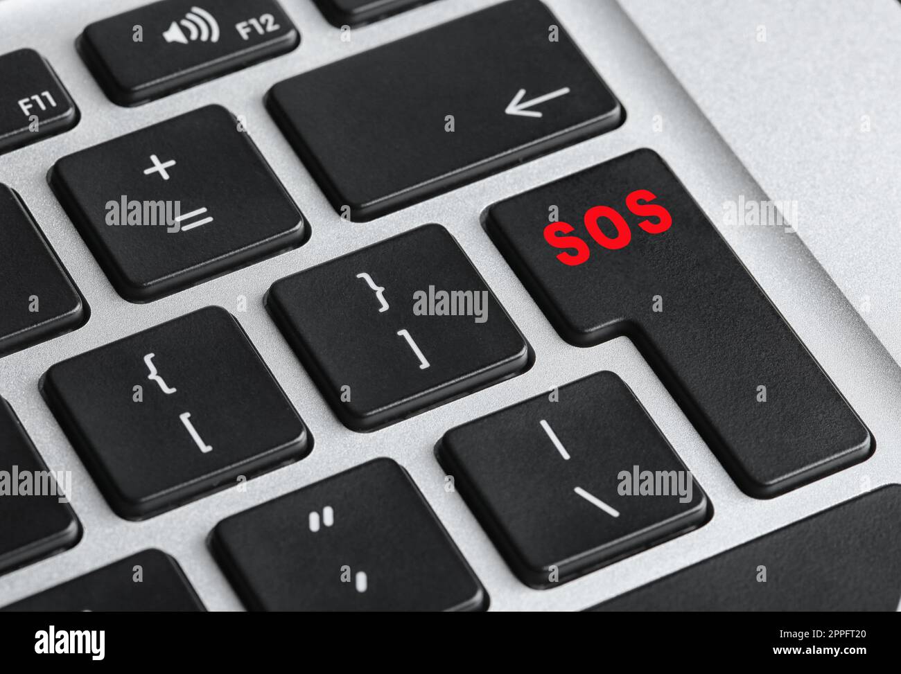 Button with word SOS on computer keyboard, closeup. Rescue concept ...