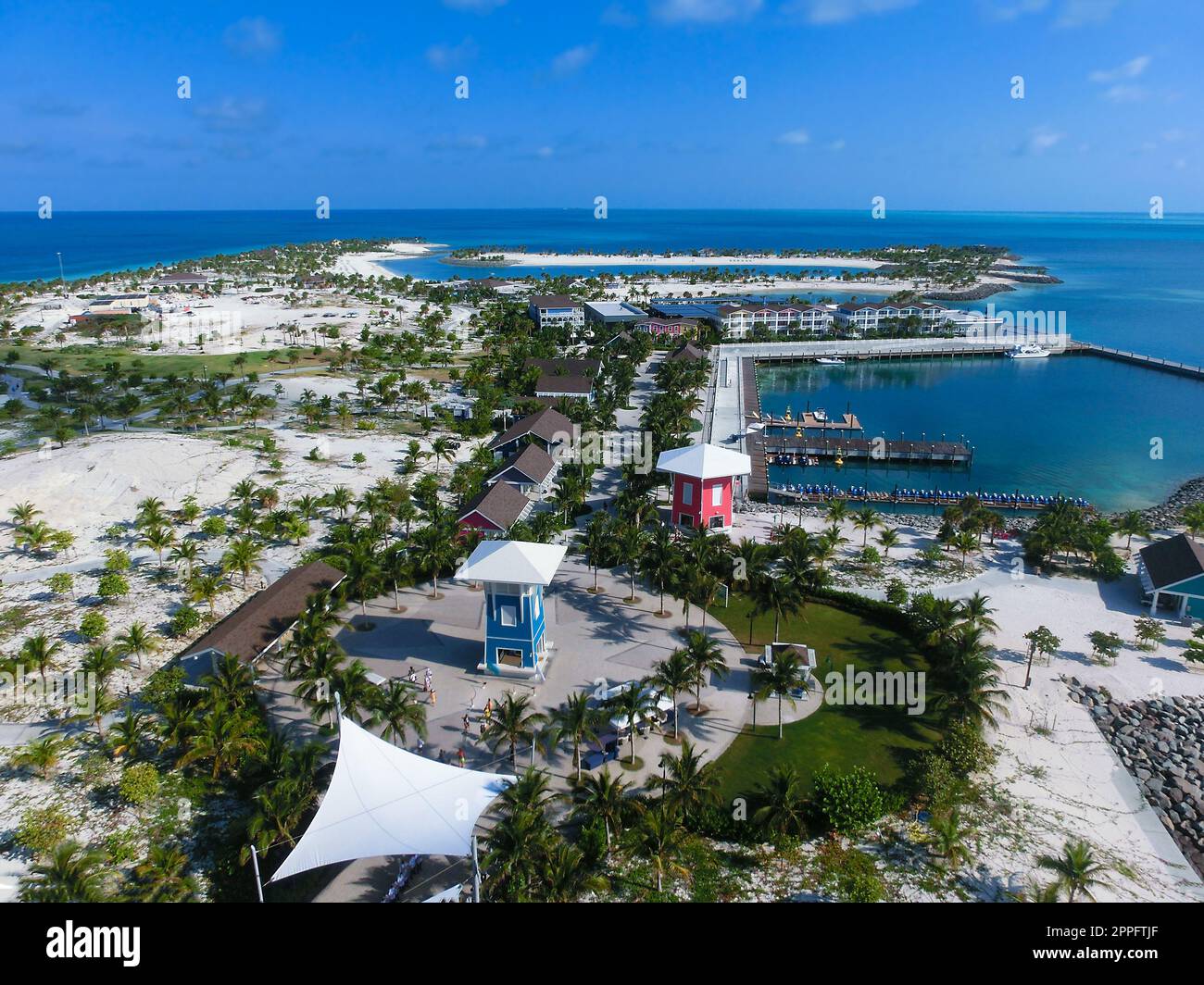 Beach on Ocean Cay Bahamas Island with a colorful houses and turquoise ...