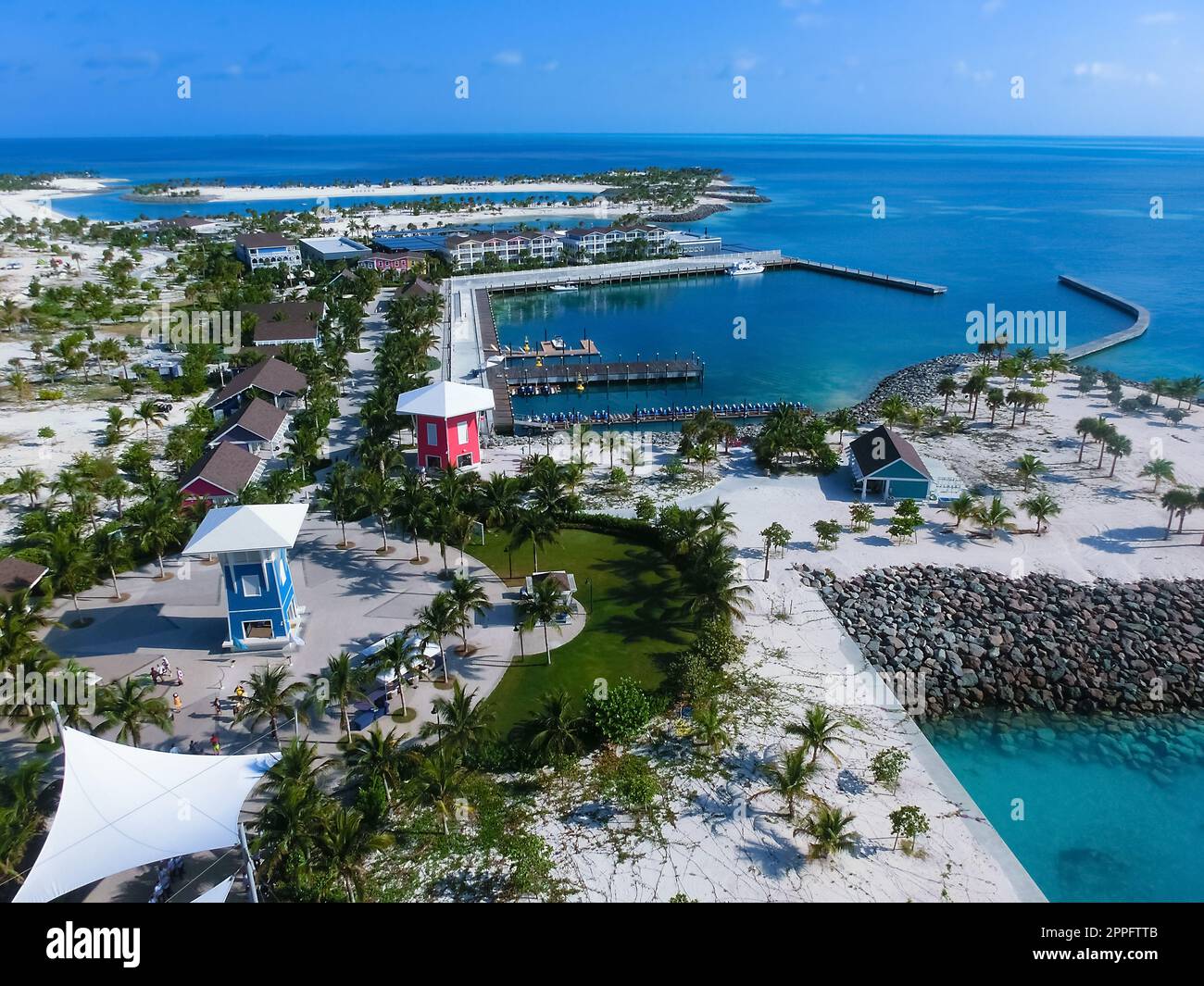 Beach on Ocean Cay Bahamas Island with a colorful houses and turquoise ...