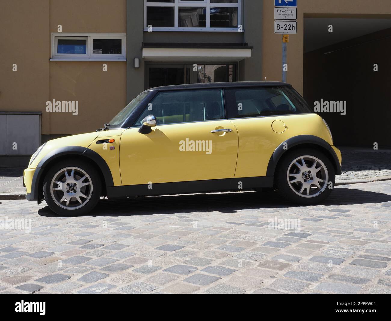 yellow Mini car in Nuernberg Stock Photo - Alamy
