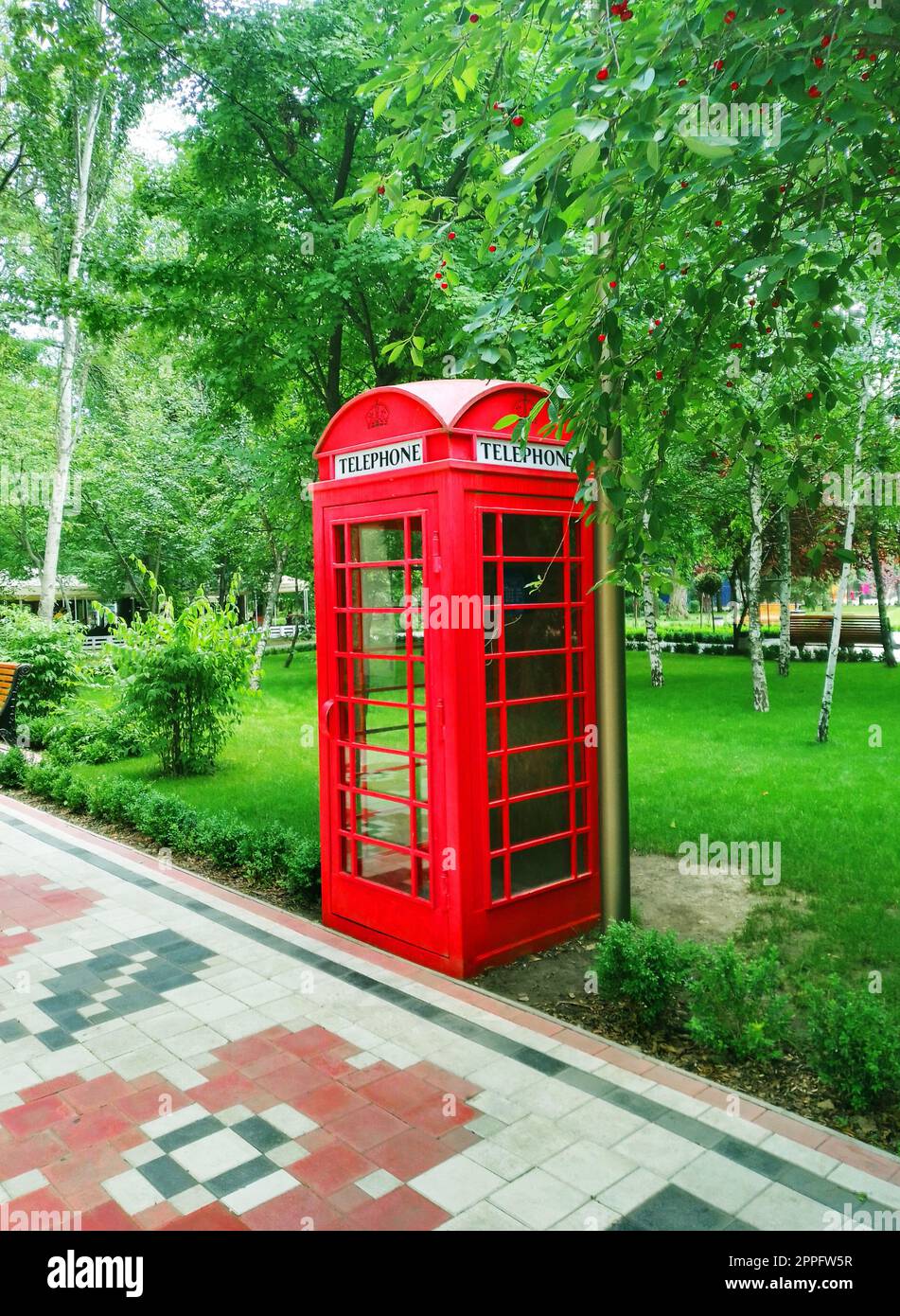 Red payphone booth in the English style in Gorky Park. Summer 2021 ...