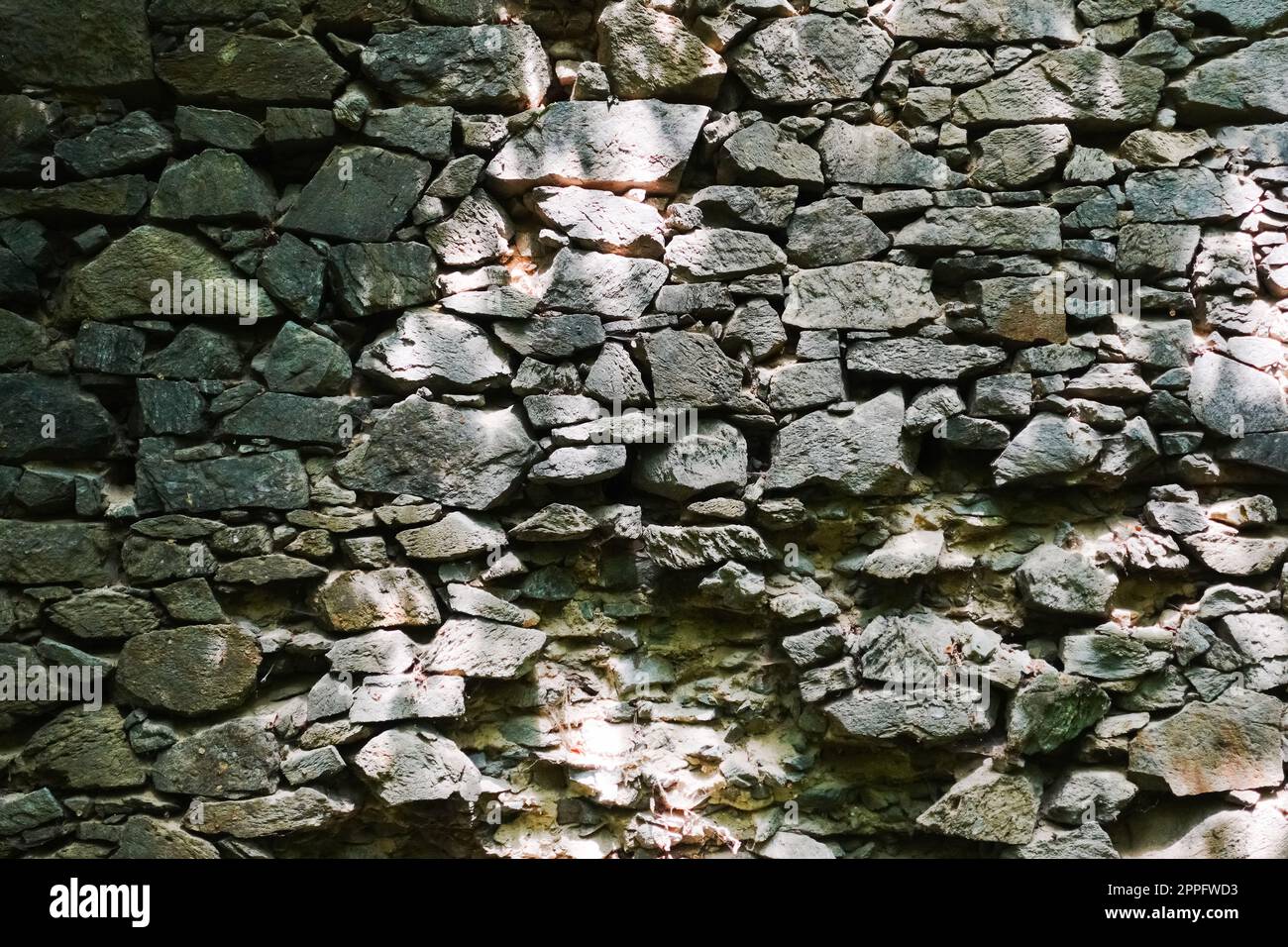 stacked stones from a old castle in a forest detail Stock Photo - Alamy