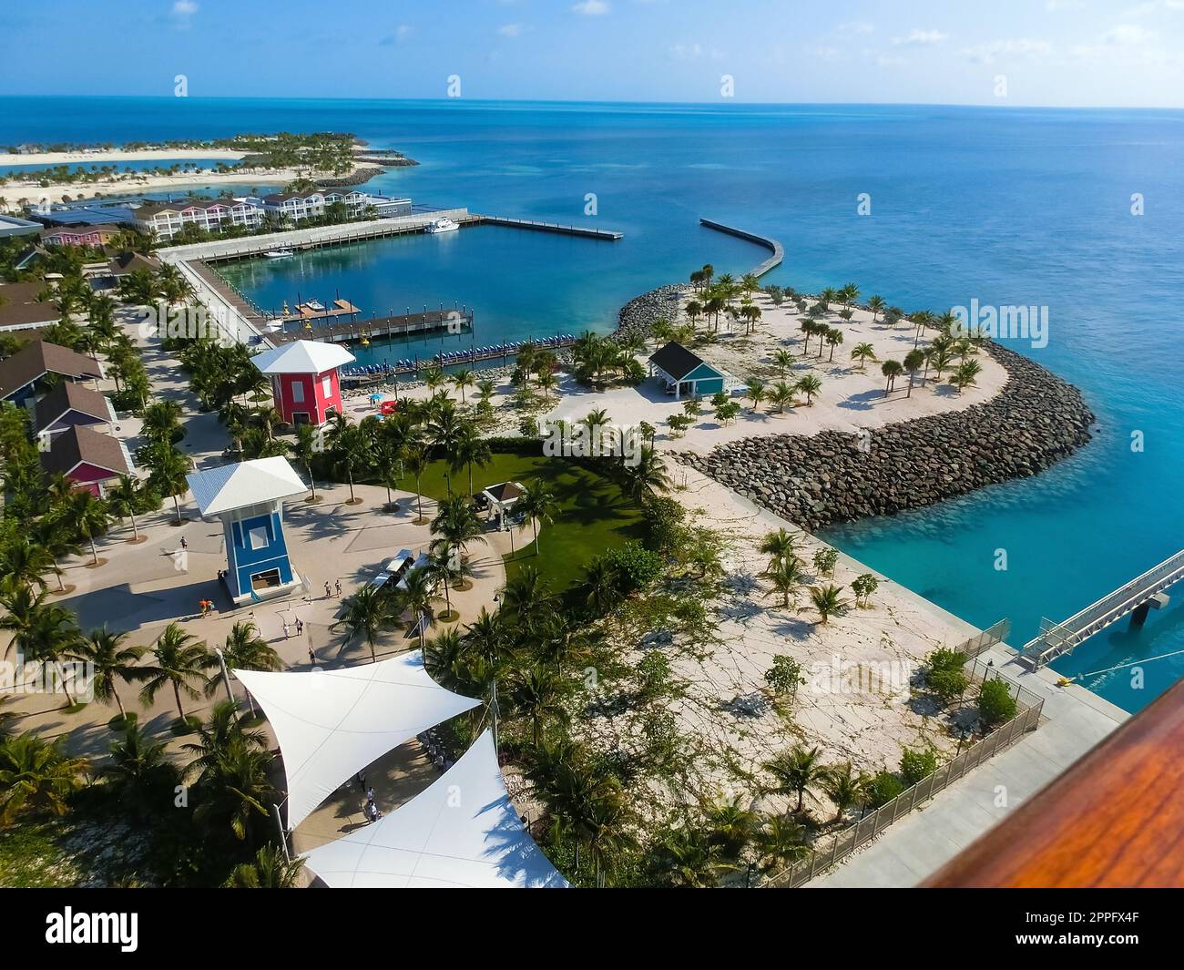 Beach on Ocean Cay Bahamas Island with a colorful houses and turquoise ...