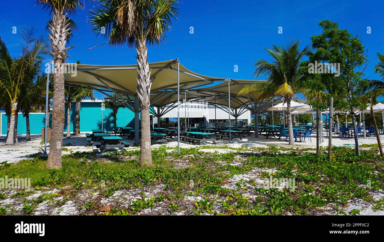 Beach on Ocean Cay Bahamas Island with a colorful houses and turquoise ...