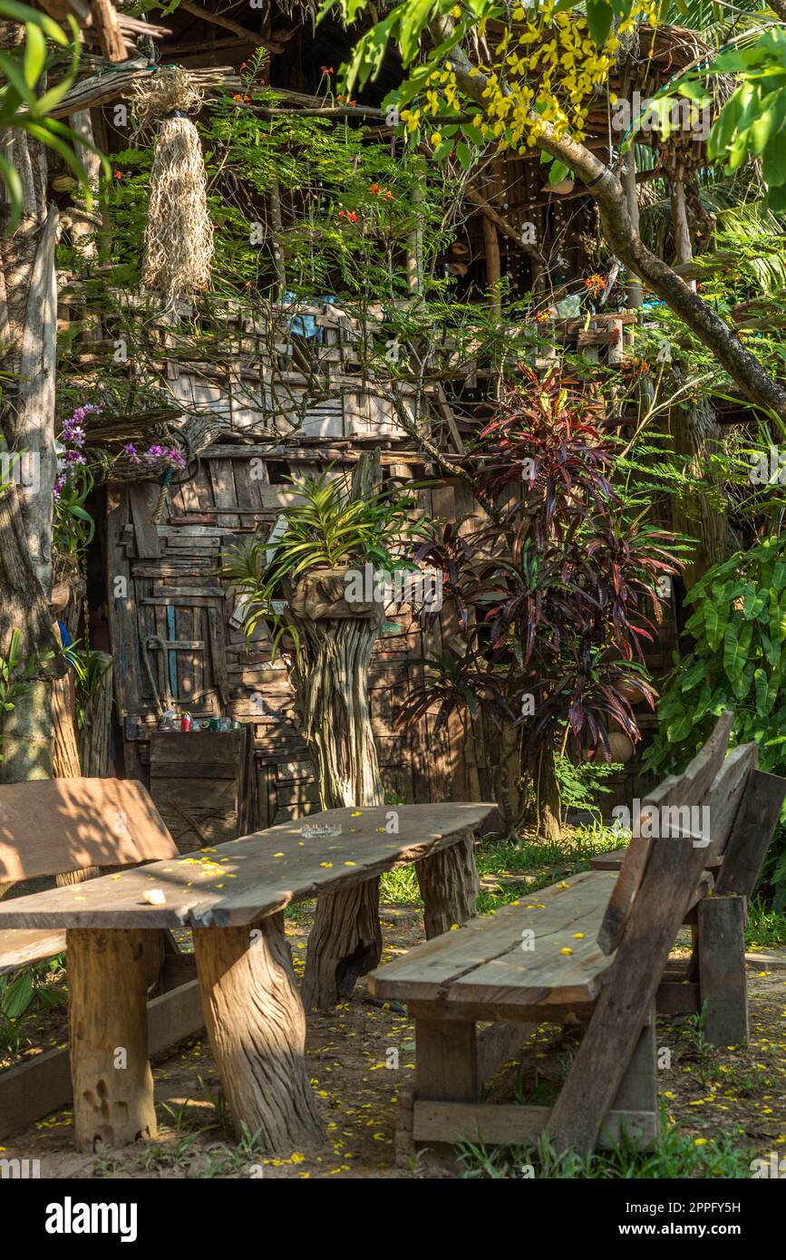 The garden of the Hippie Bar is decorated with flowers, mobiles ...