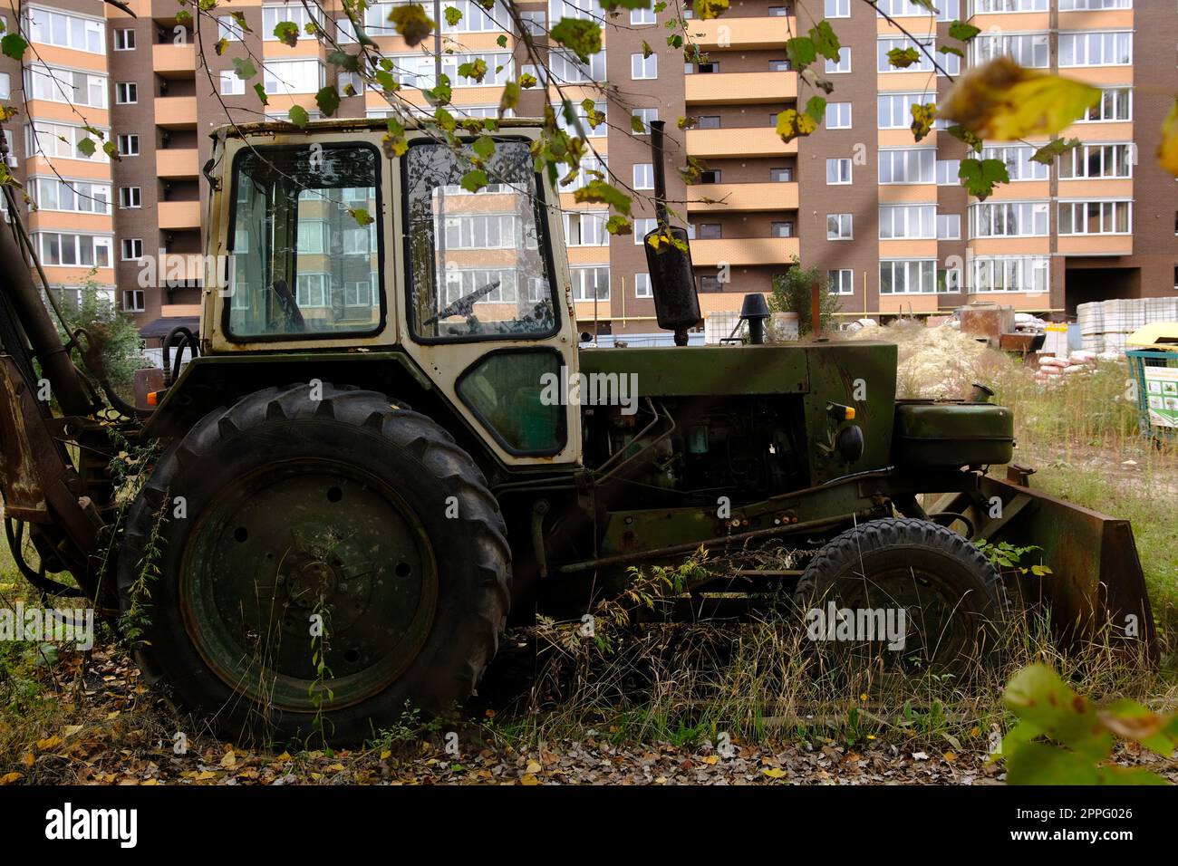 New modern building in process with vintage tractor green color Stock ...
