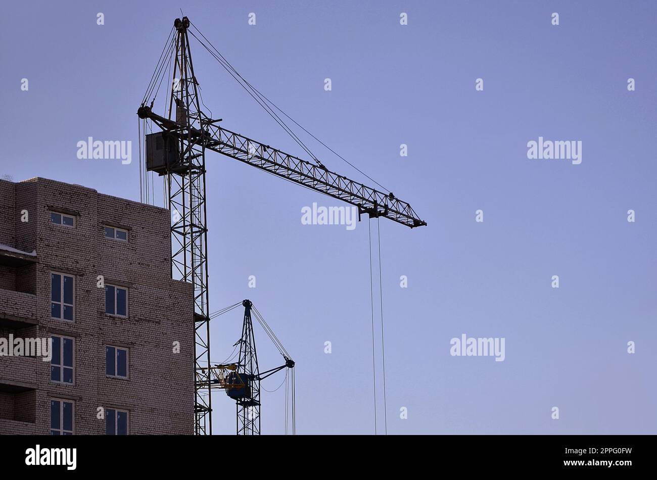 Building under construction with crane Stock Photo - Alamy