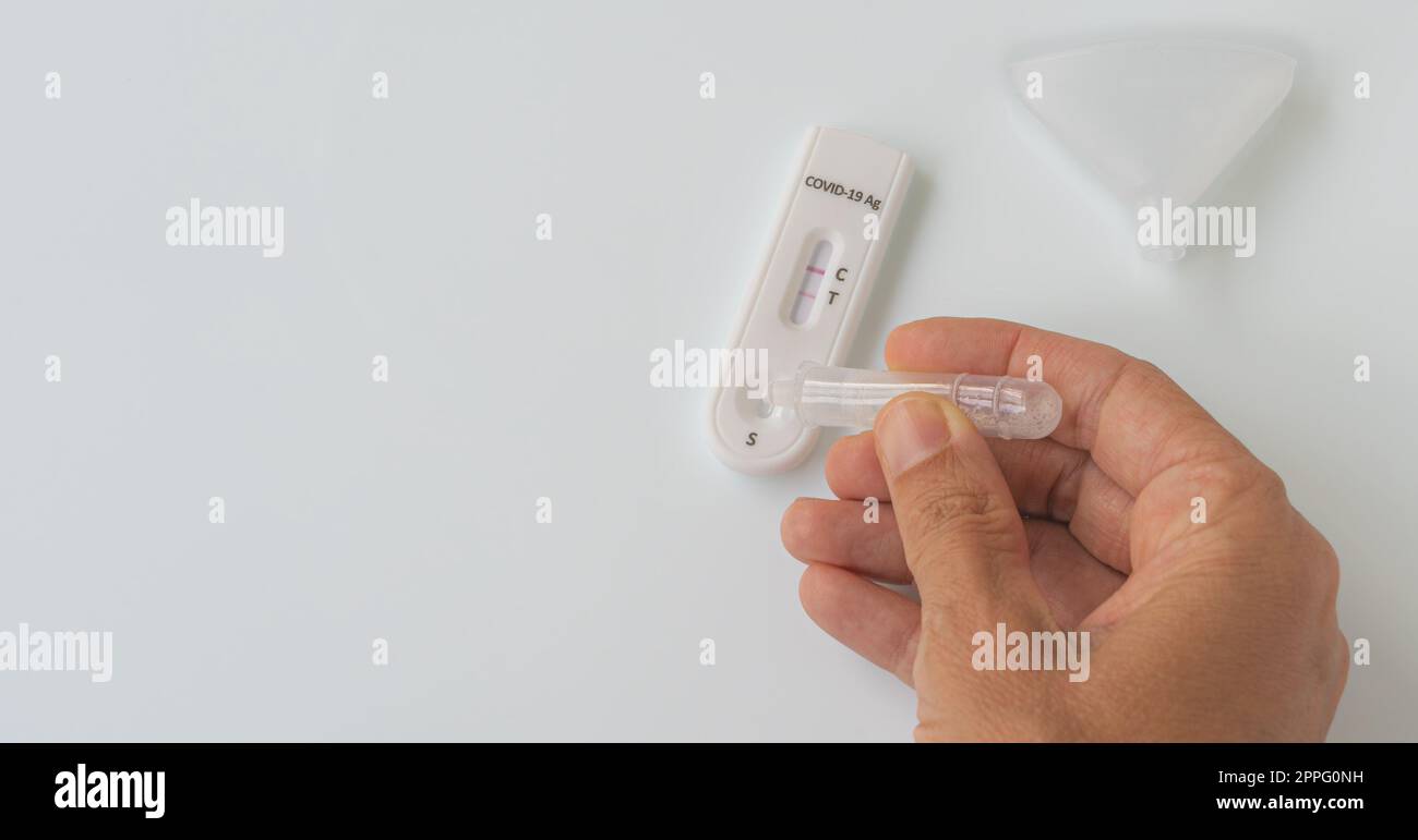 Making Coronavirus antigen test with positive result Stock Photo - Alamy