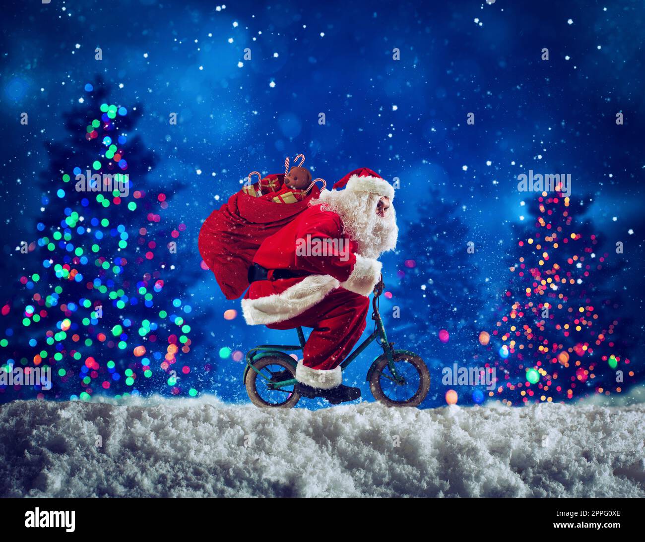 Santaclaus rides bike to deliver fast christmas gifts Stock Photo - Alamy