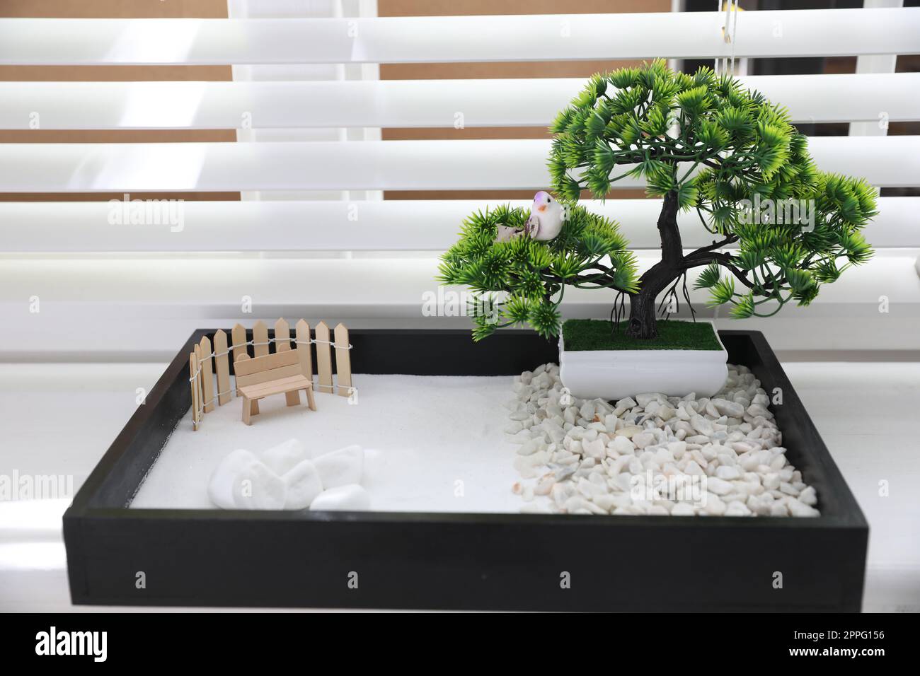 Beautiful miniature zen garden on window sill Stock Photo - Alamy