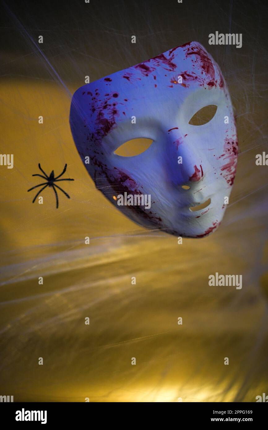 Color image of a white mask, painted with blood Stock Photo - Alamy