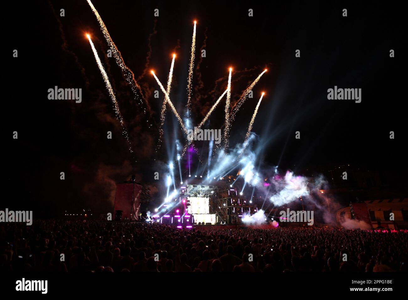salute and fireworks on a music stage with spotlights at night Stock ...
