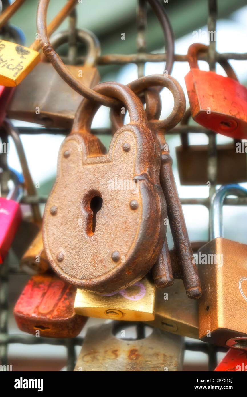 Love lock as a symbol of love and unity hanging on a bridge railing ...