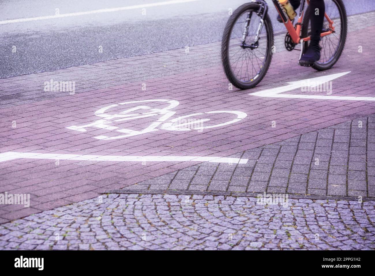 Cycle path, bicycle symbol as a lane marking or road marking on a road ...