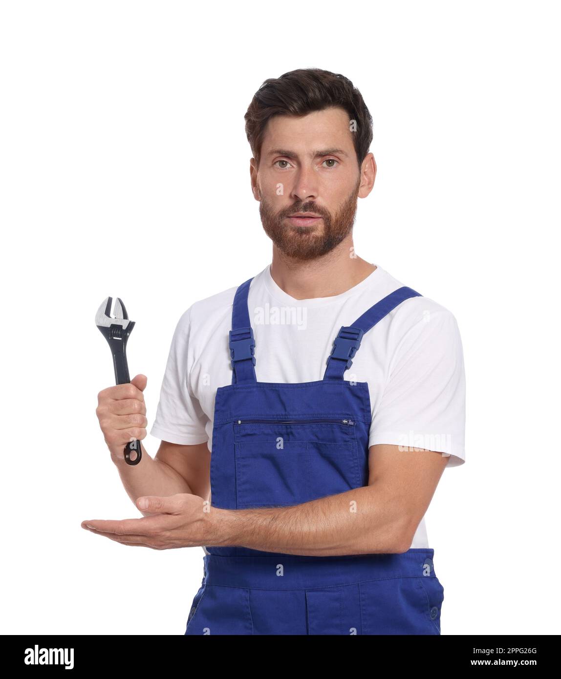Professional plumber with adjustable wrench on white background Stock ...