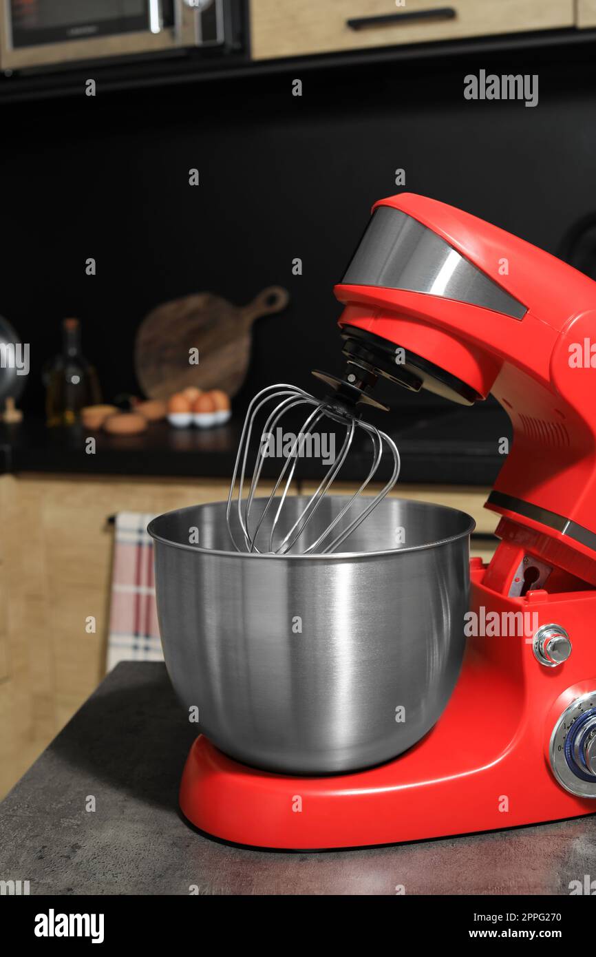 Modern stand mixer on grey table in kitchen Stock Photo - Alamy