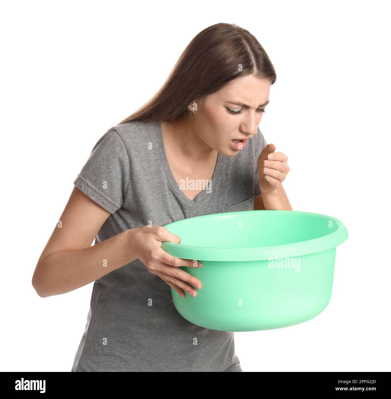 Woman with basin suffering from nausea on white background. Food ...