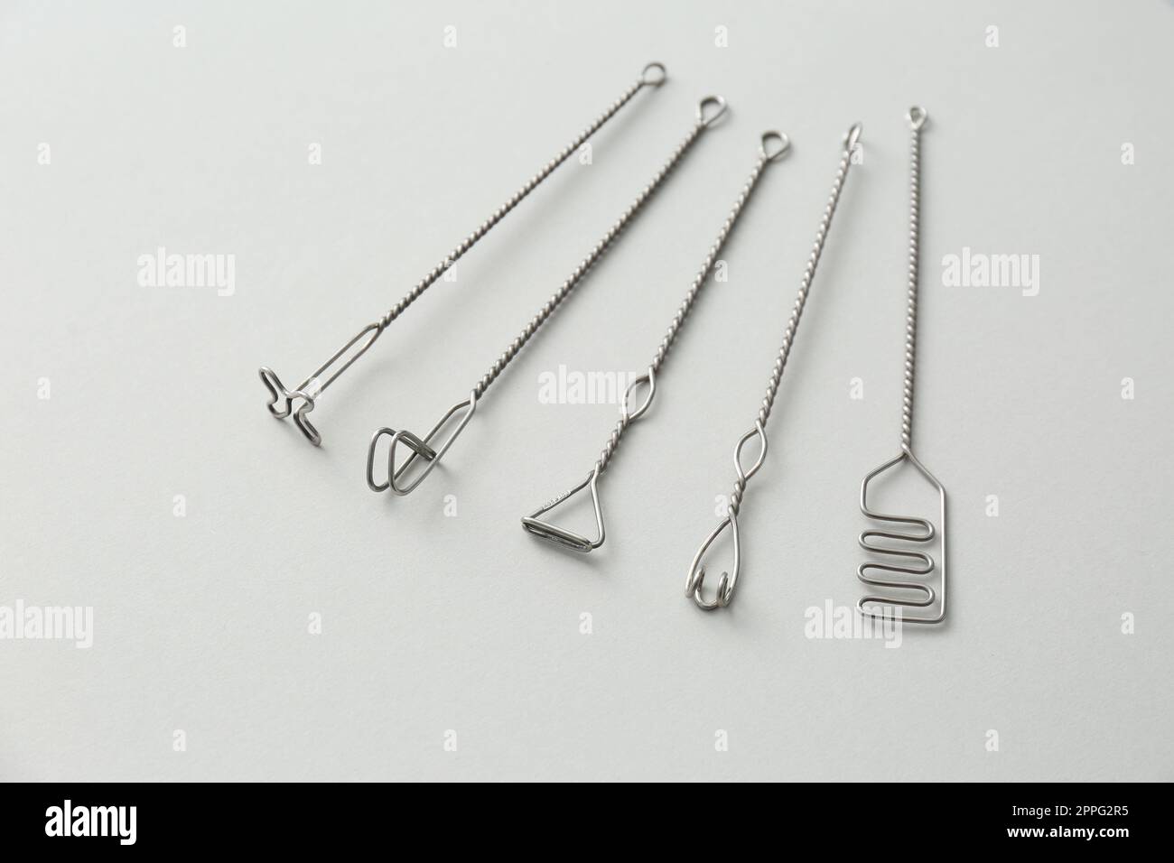 Set of logopedic probes for speech therapy on light grey background ...