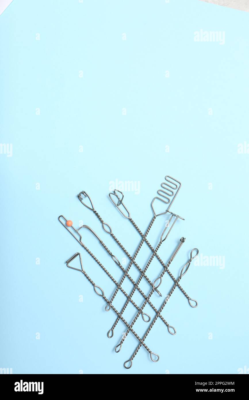 Set of logopedic probes for speech therapy on light blue background ...