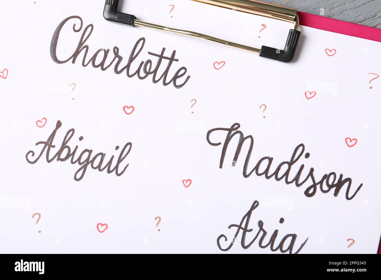 Clipboard with different baby names, closeup view Stock Photo - Alamy
