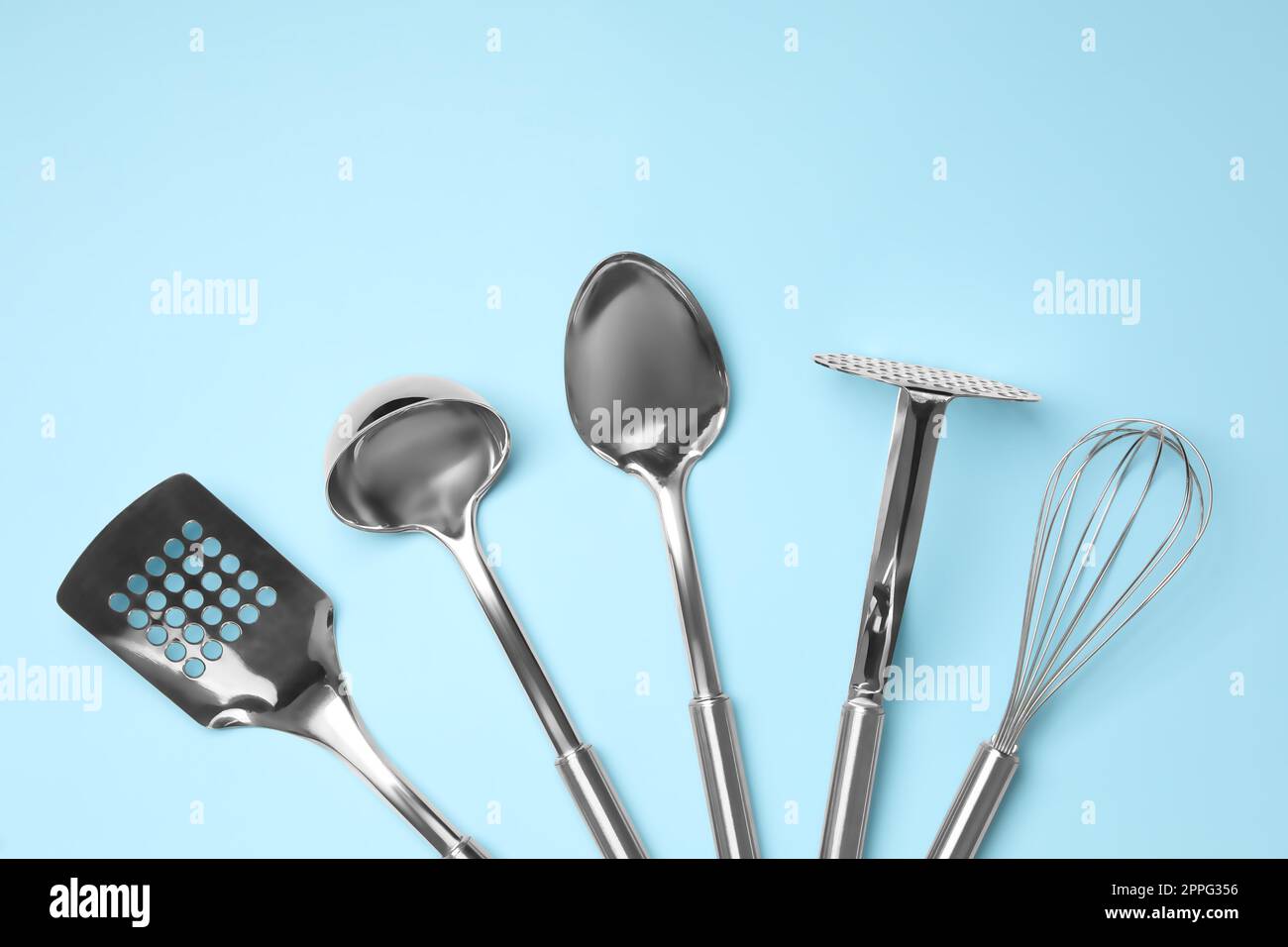 Set of modern cooking utensils on light blue background, flat lay Stock ...