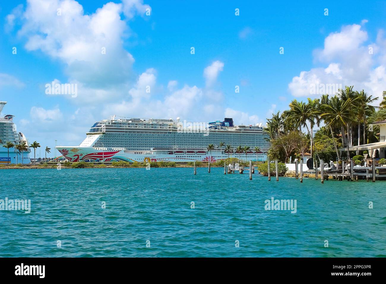 Port of Miami with cruise ships Norwegian Joy. Miami is a major port in ...