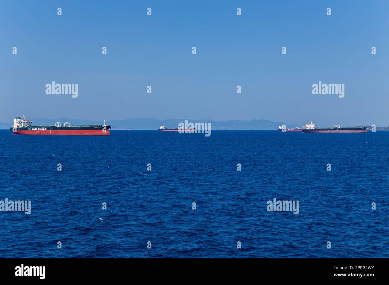 Merchant vessels and cargo container Stock Photo - Alamy