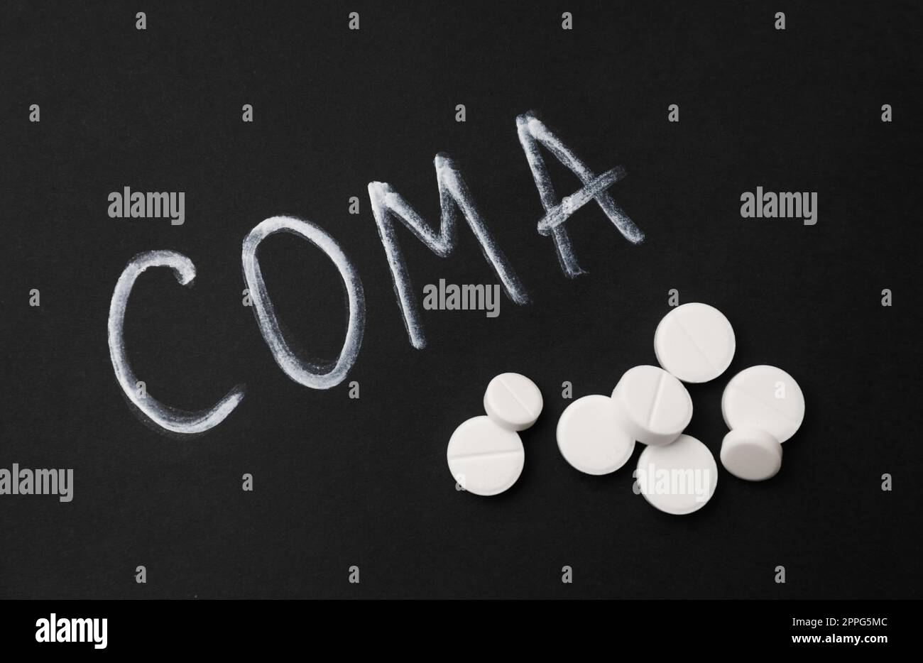 Pills and word Coma written on black background, flat lay Stock Photo ...