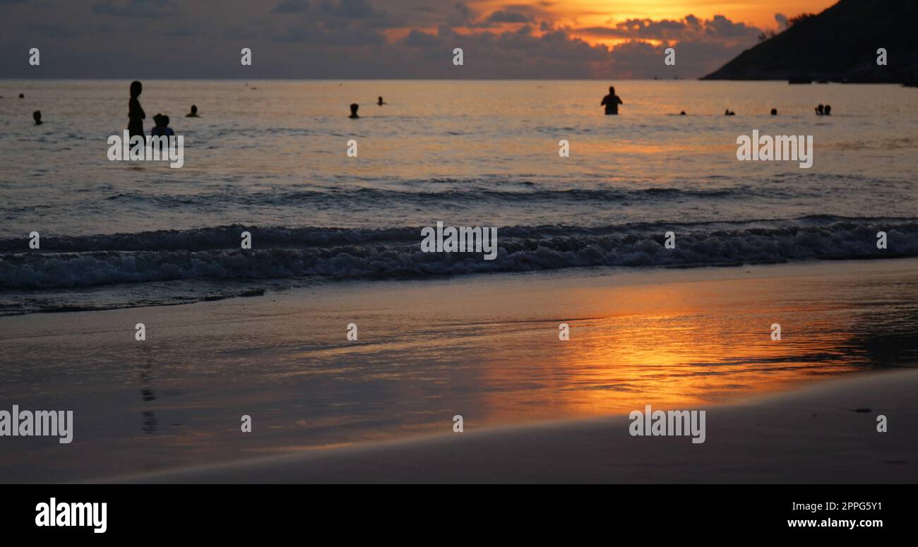 Sunset sandy beach and sea Stock Photo - Alamy