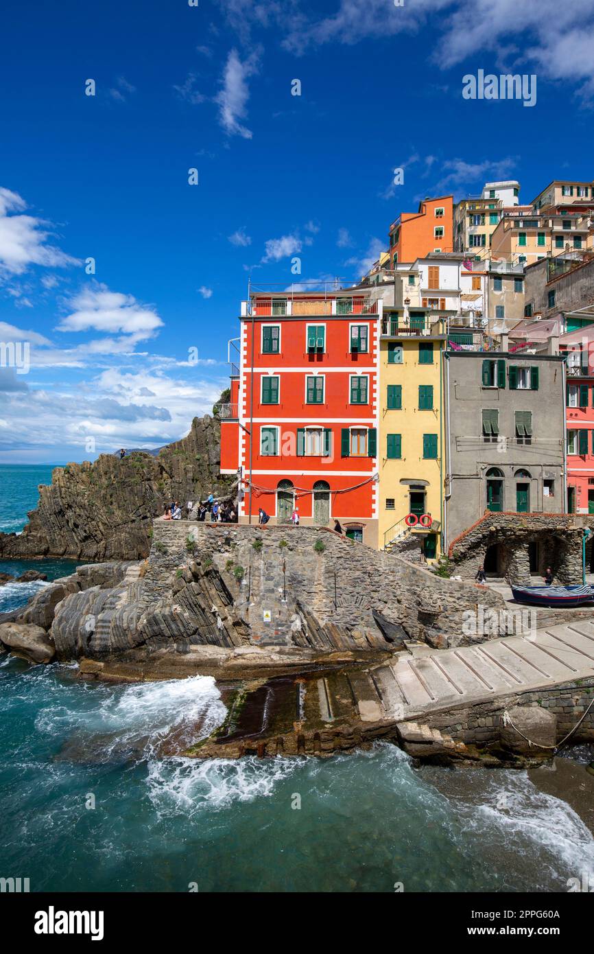 View on seaside and typical colorful houses in small village, Riviera di Levante, Riomaggiore ...