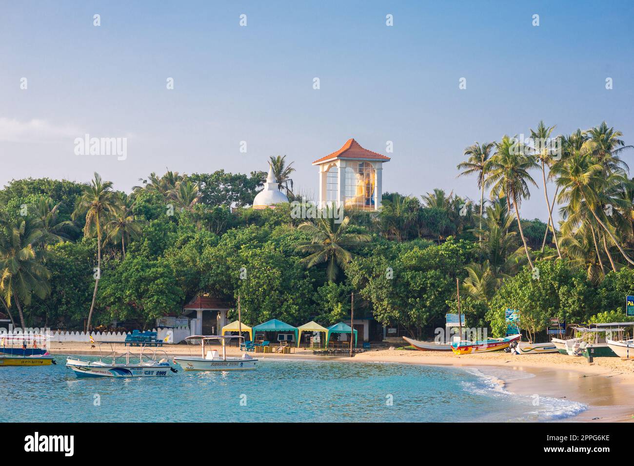 Beach and the Buddhist monastery and temple Wella Devalaya in Unawatuna ...