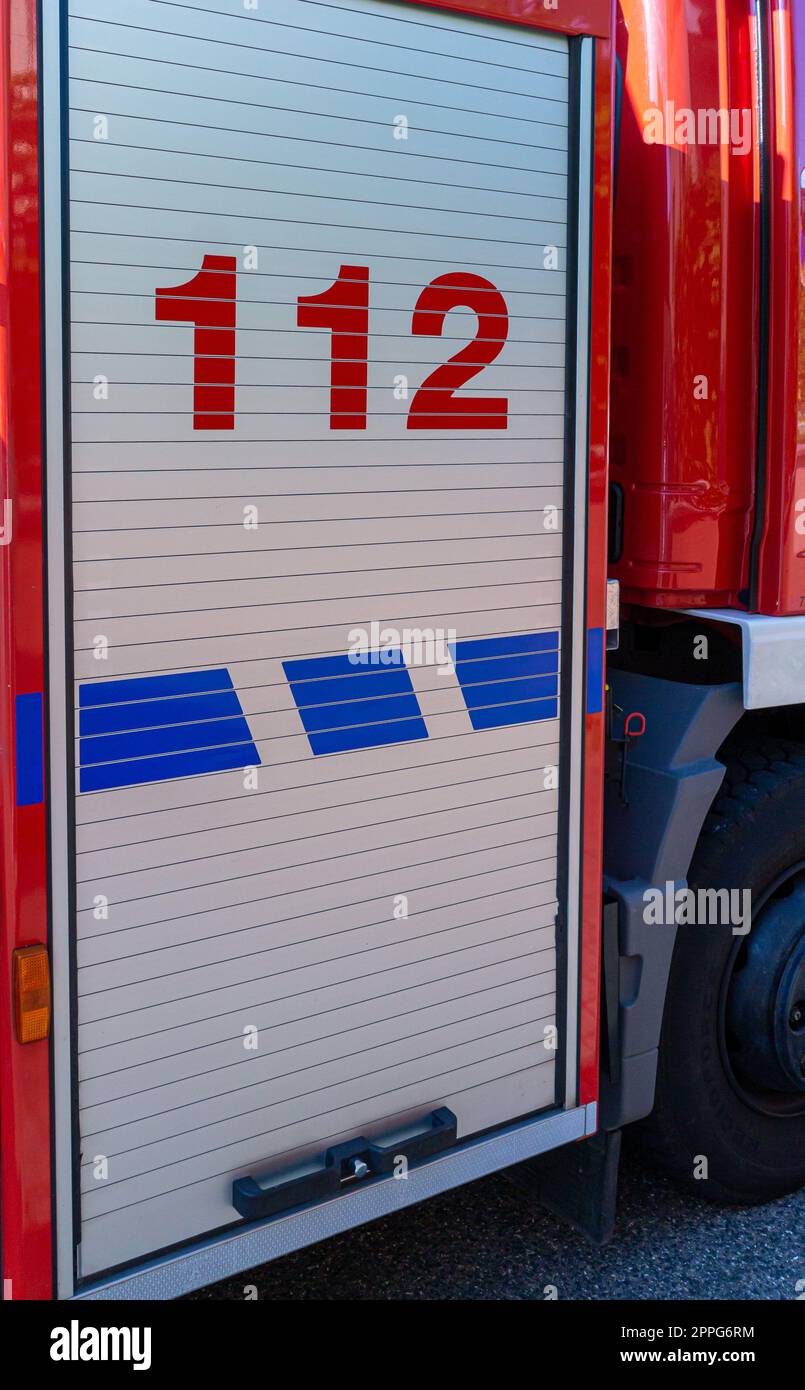 Roller Shutter door with emergency number Stock Photo - Alamy